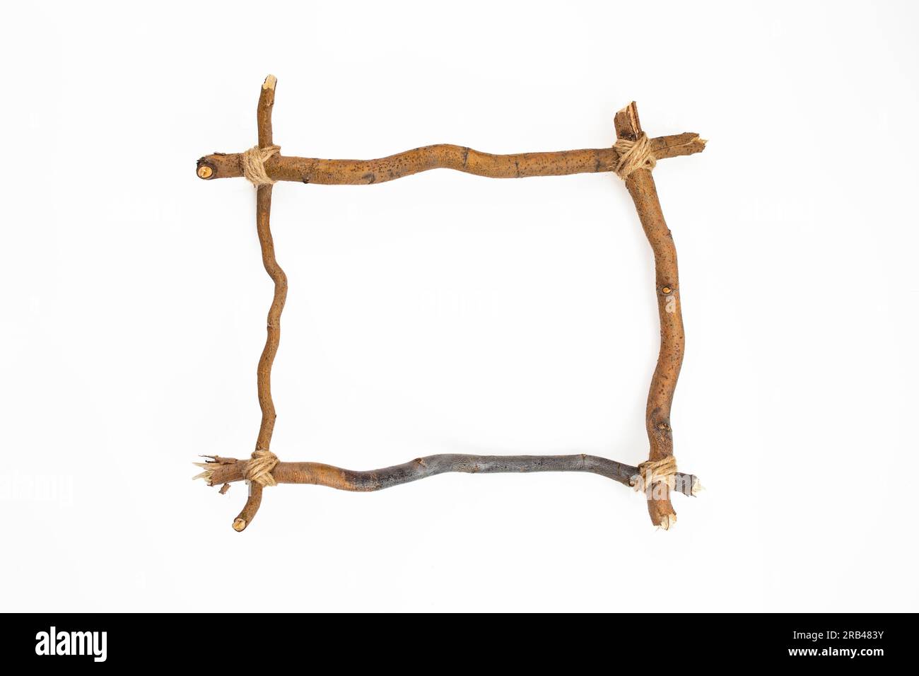 Willow tree branches tied with jute rope , in form of a frame, close up ...