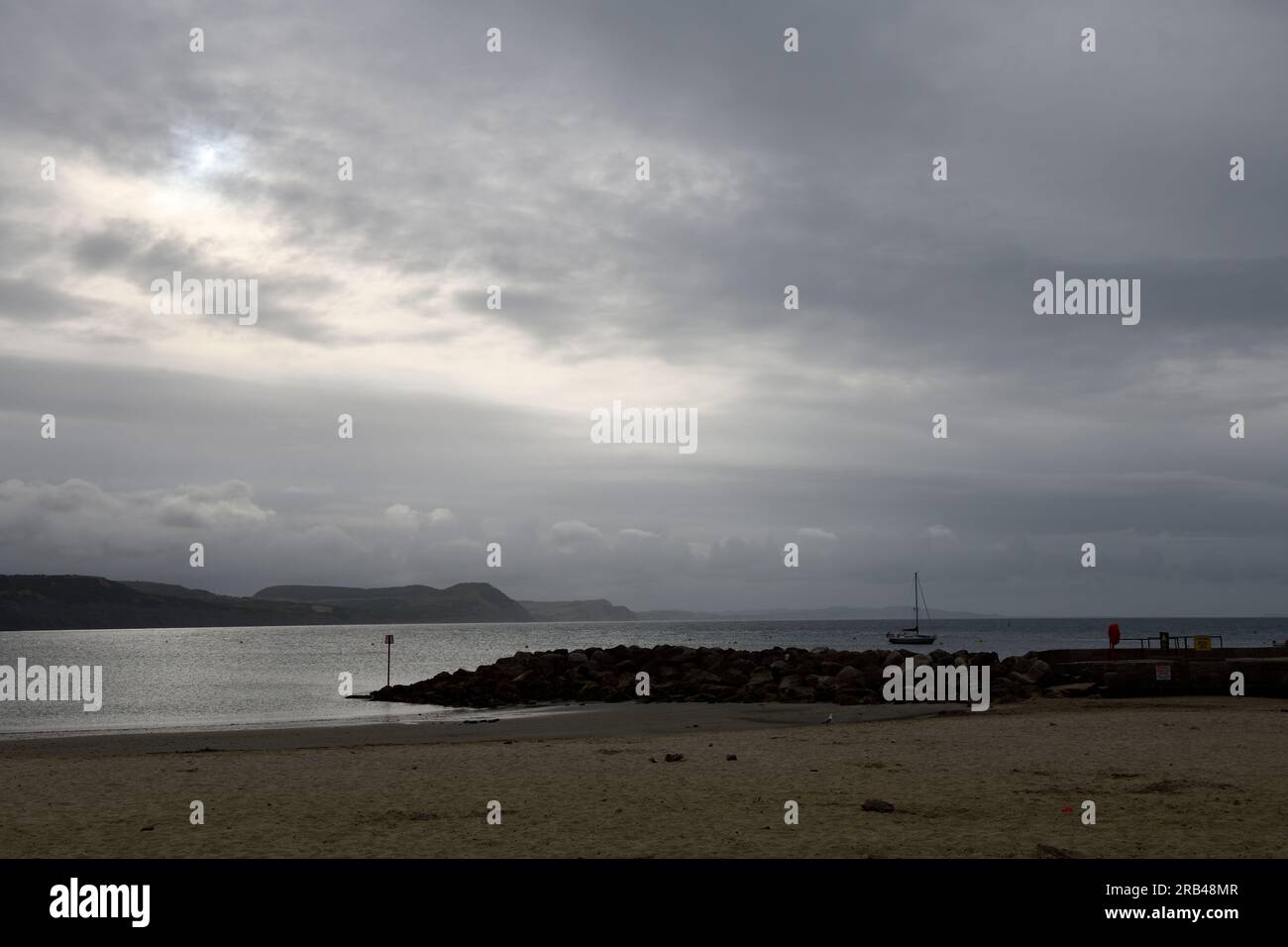 Lyme Bay with Sailing Boat moored in the Bay Lyme Regis Dorset England ...