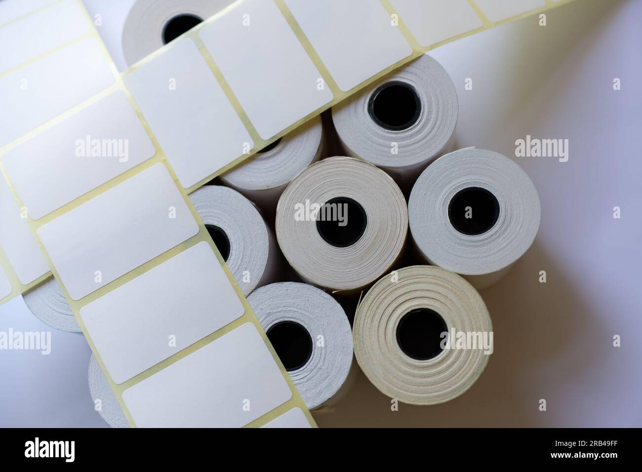 Rolls of white labels isolated. Labels for direct thermal or thermal ...