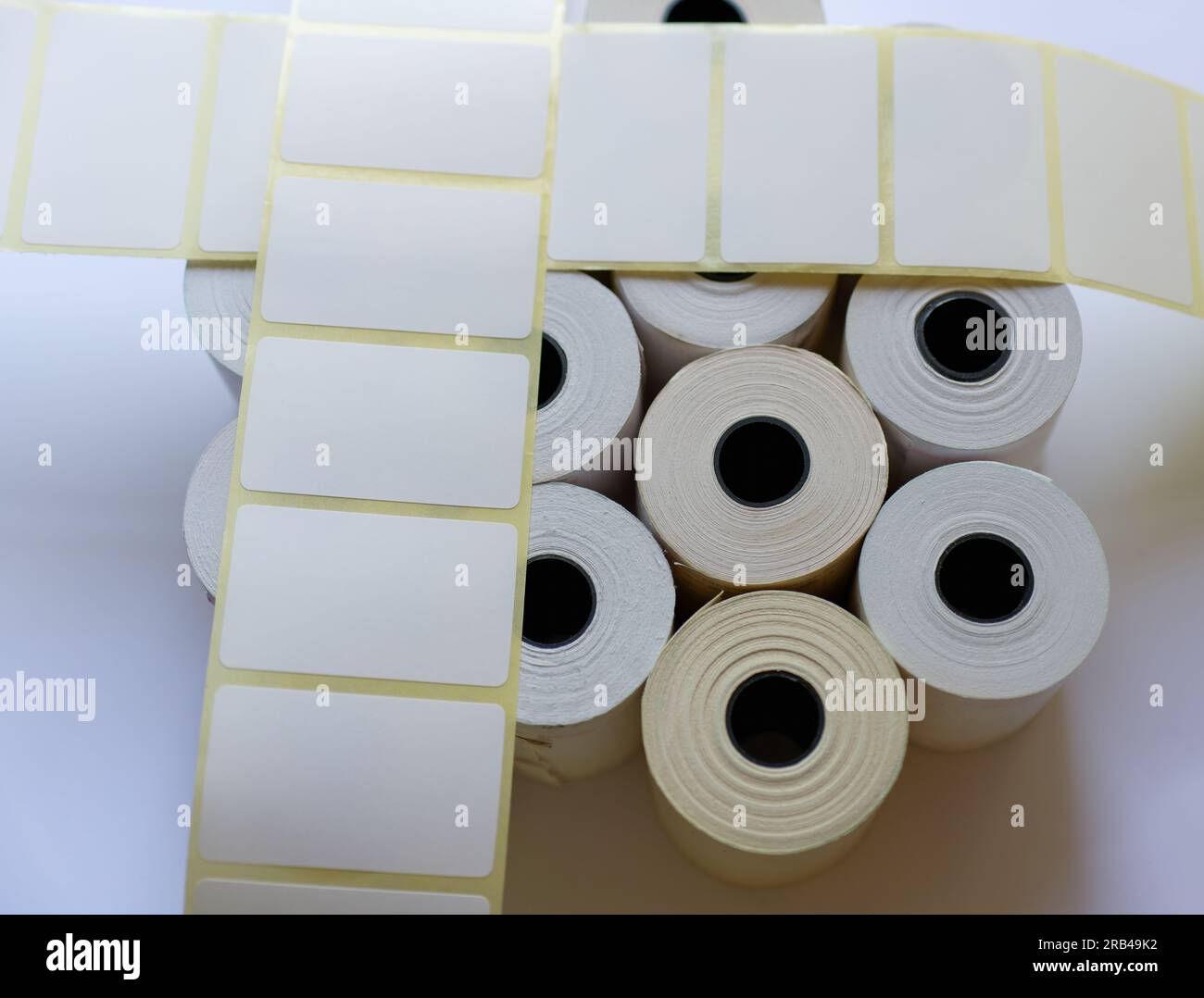 Rolls of white labels isolated. Labels for direct thermal or thermal ...