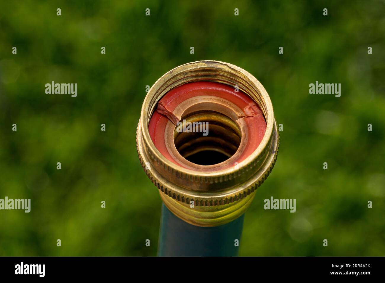 Garden hose with broken rubber washer. Home repair, maintenance and ...