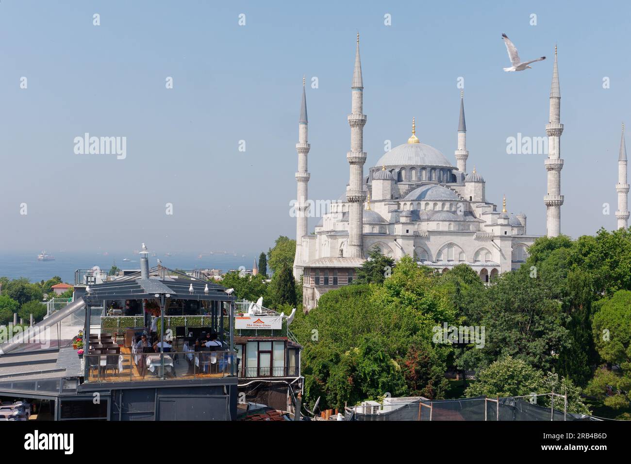 Elevated view of the Sultan Ahmed Mosque aka Blue Mosque. People dine ...