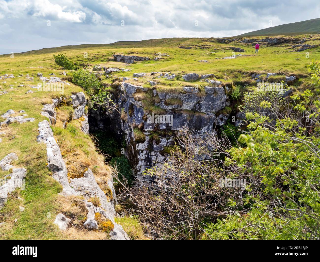 The entrance to Rowten Pot above Kingsdale in the Yorkshire Dales, UK ...