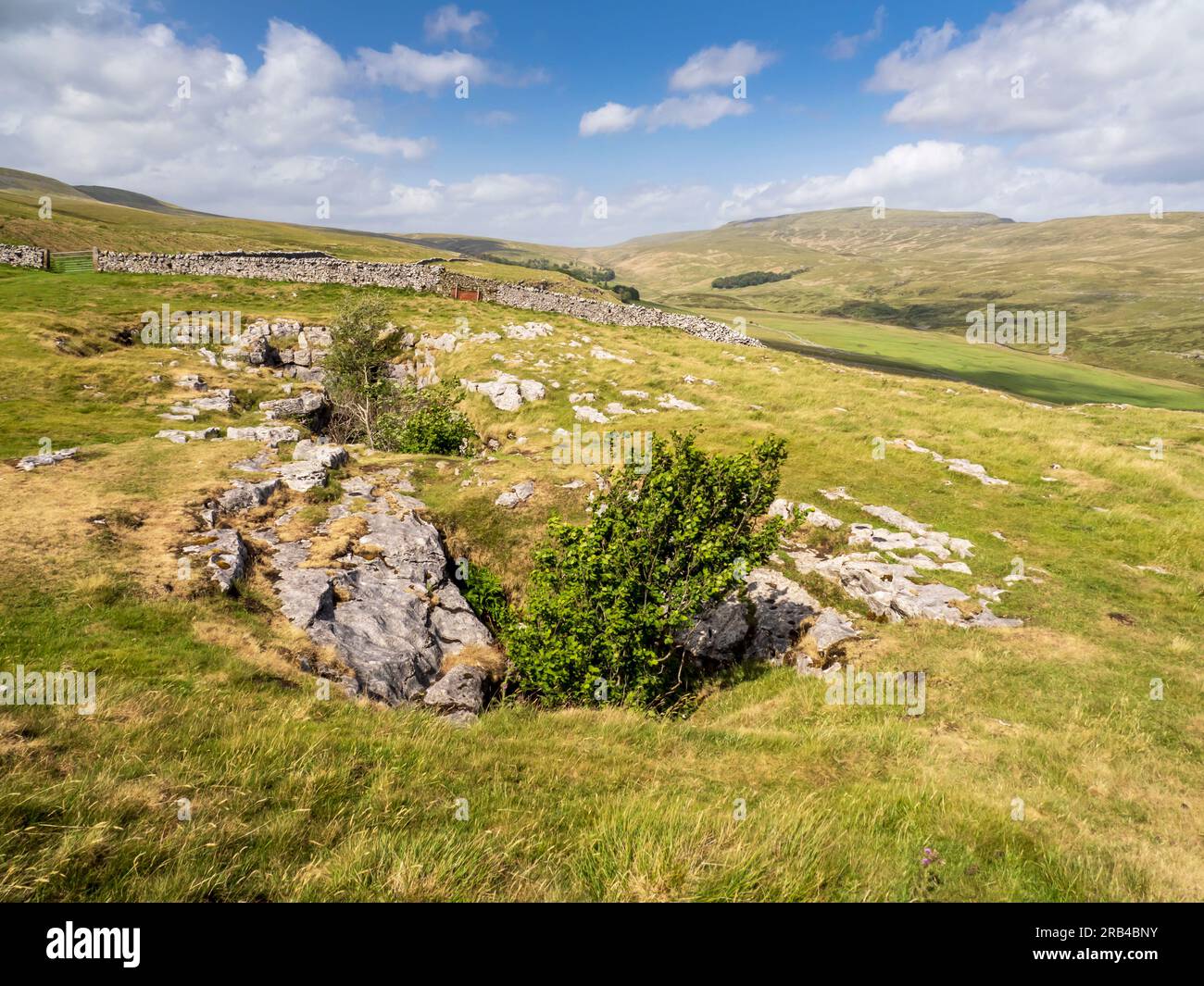 The entrance to Rowten Pot above Kingsdale in the Yorkshire Dales, UK ...