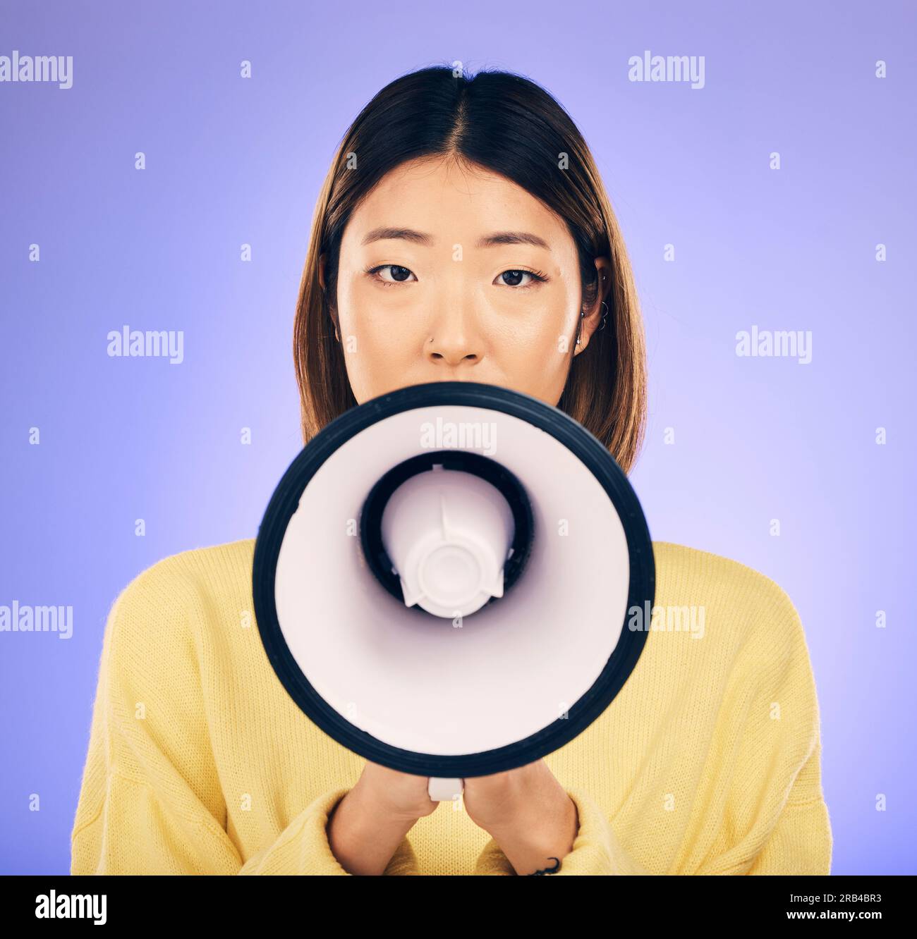 Woman, megaphone and portrait in studio for announcement, voice or ...