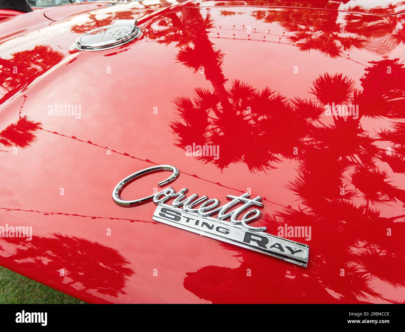 Logo of red, 1963 model Chevrolet Corvette Stingray Convertible seen ...