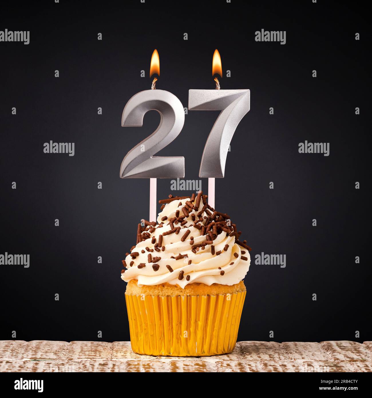 Birthday candle number 27 - Anniversary cupcake on black background ...