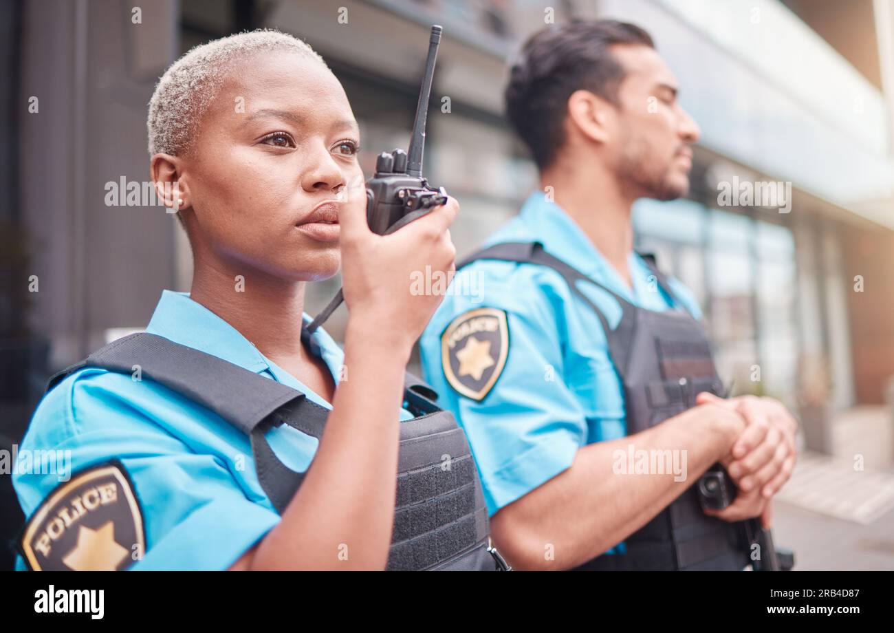 Police, radio and patrol with a black woman officer outdoor on a city ...