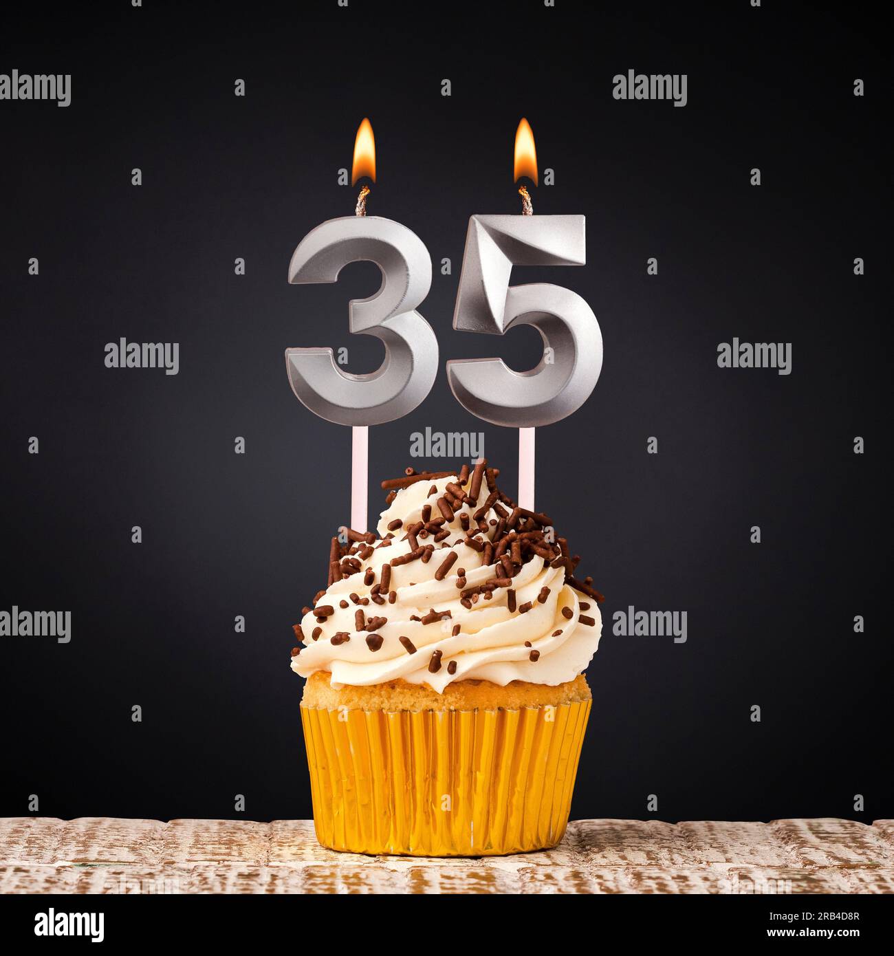 Birthday candle number 35 - Anniversary cupcake on black background ...