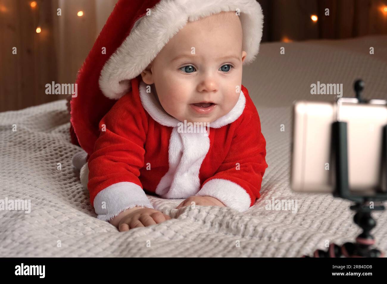 Smiling Baby Wearing Red Santa Claus Costume Making Video Call looking ...