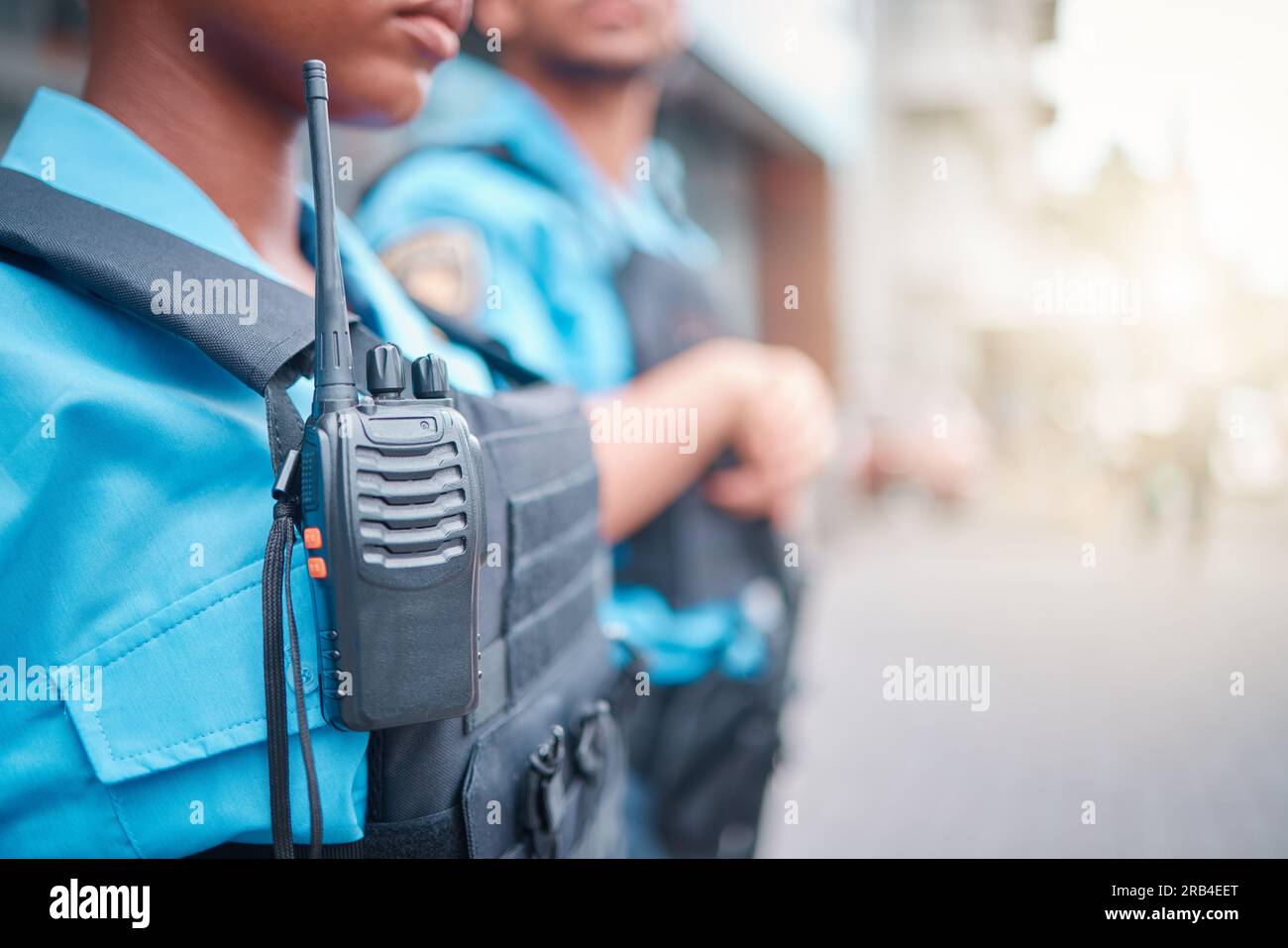 Radio, police and surveillance with a black woman officer standing ...