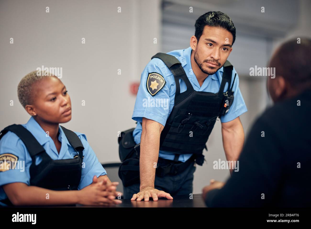 Interrogation, arrest and police team with a suspect for questions as ...