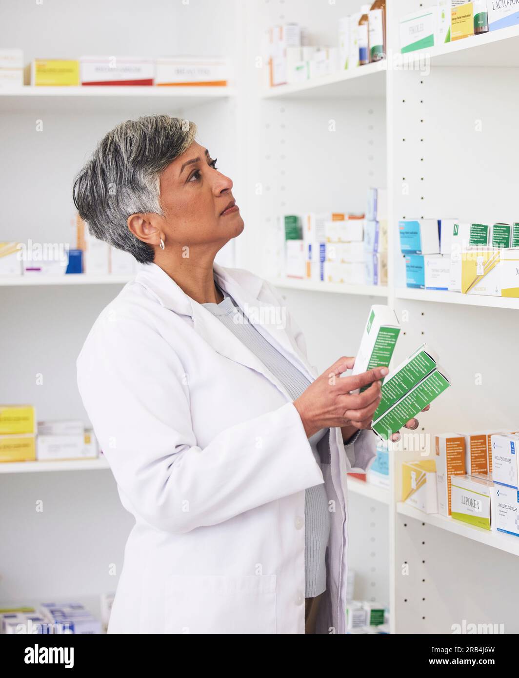 Senior pharmacist woman, shelf and boxes with thinking, packing stock ...