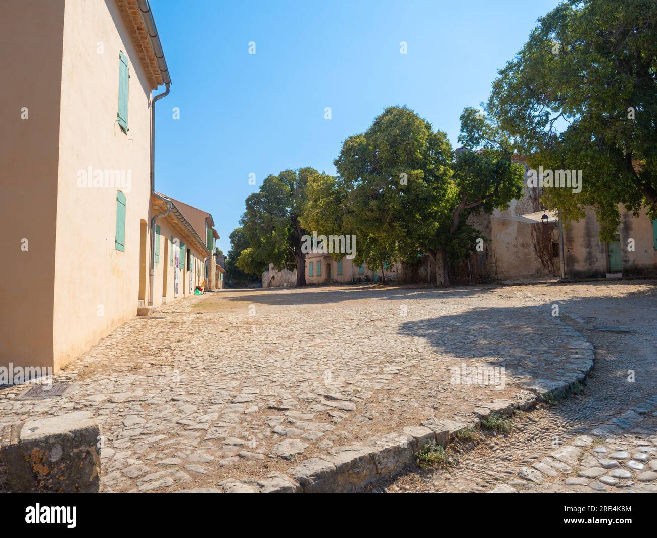 Small square surrounded by buildings Stock Photo - Alamy