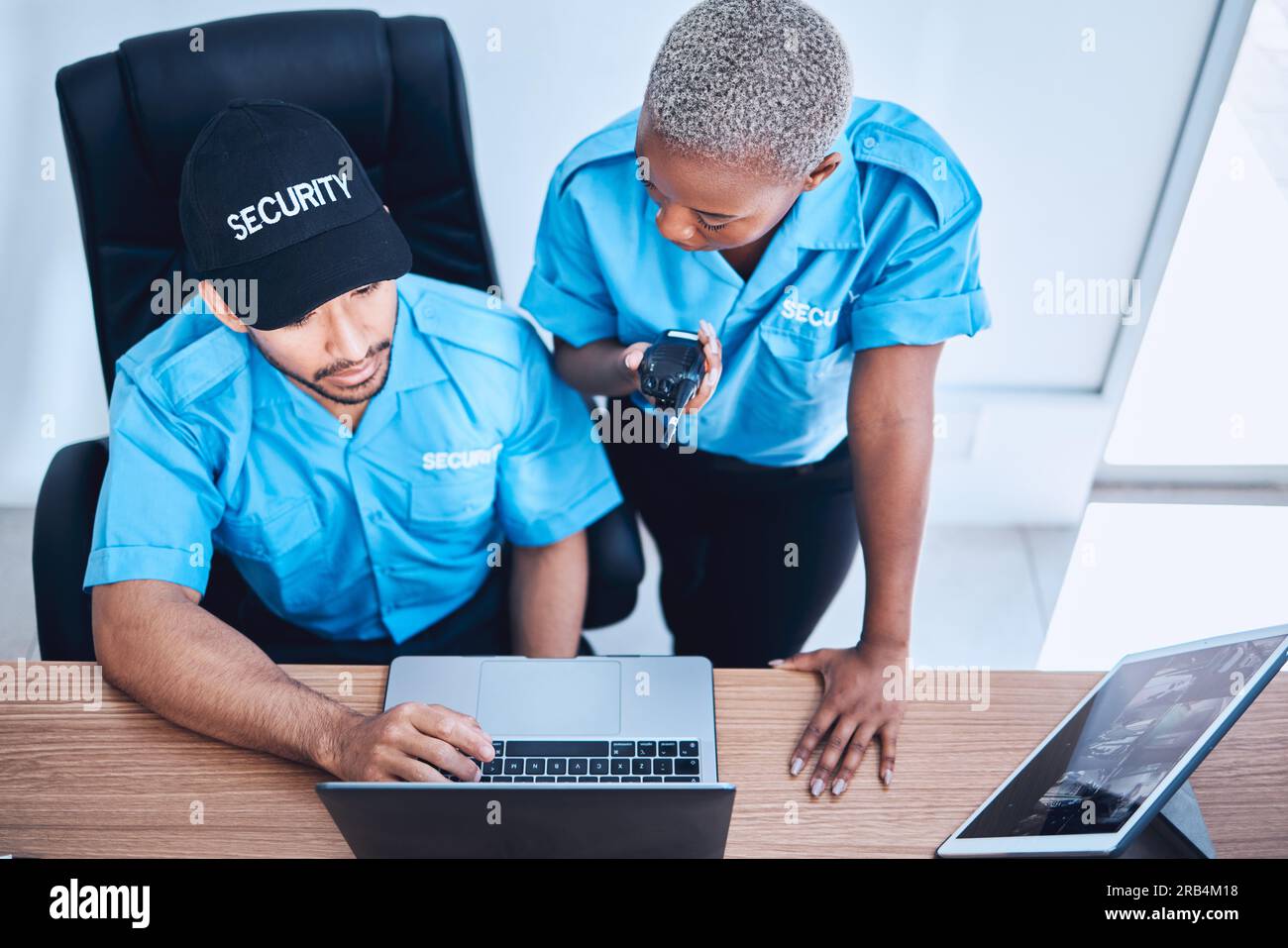Security guard, laptop and police team watching surveillance footage of ...