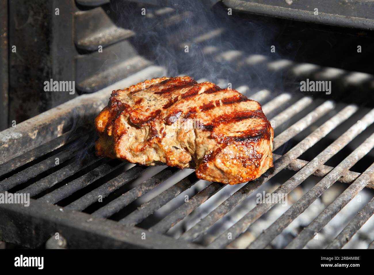 Steak. Preparation of steak on the grate Stock Photo - Alamy