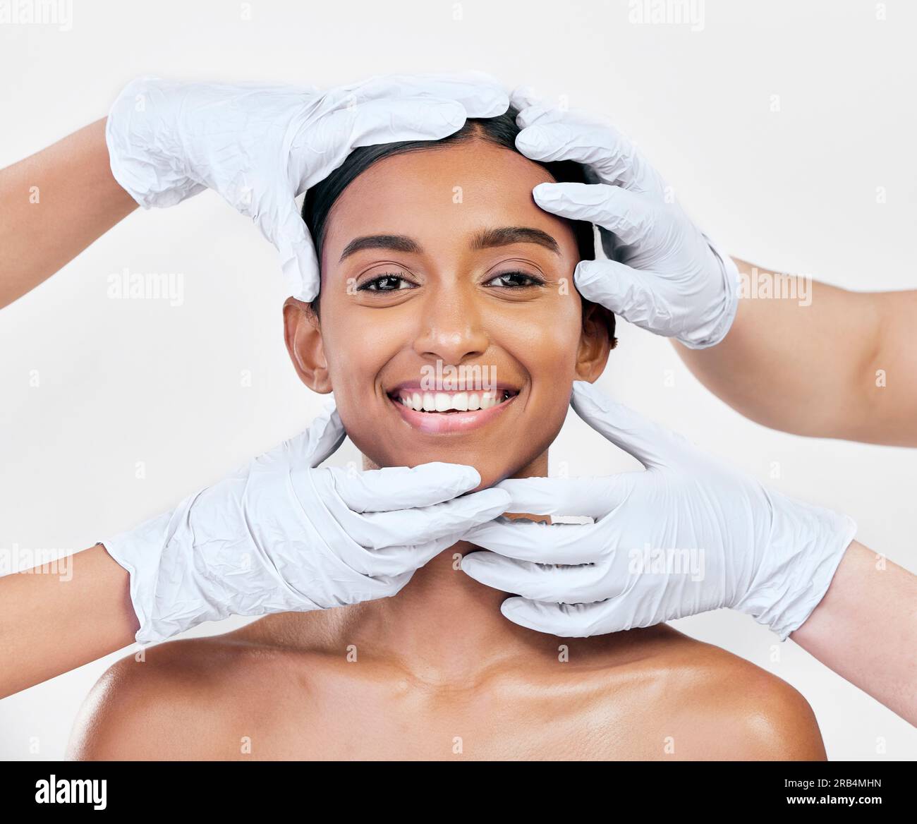 Woman, plastic surgery and gloves in studio portrait with smile for ...