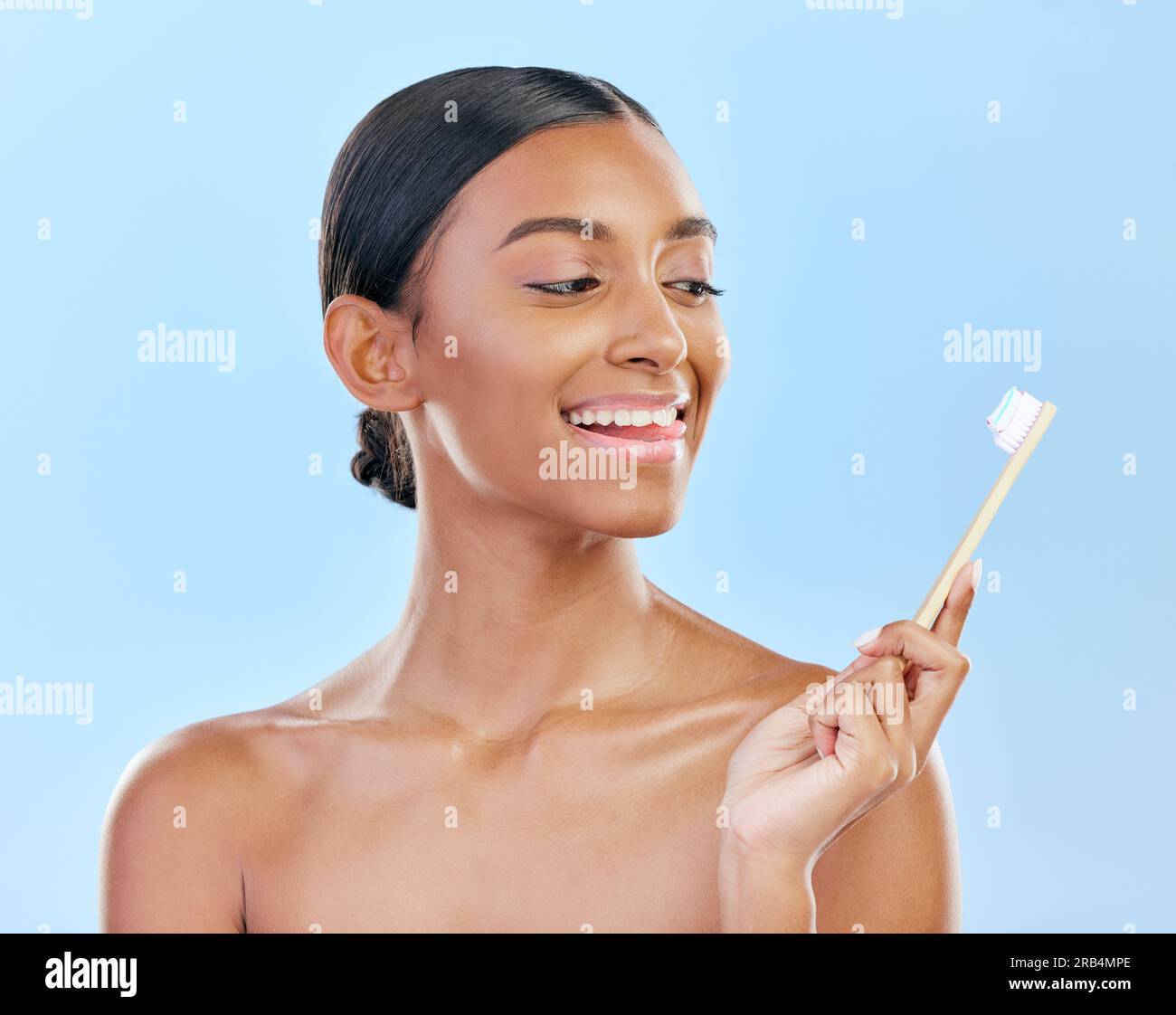 Face, toothbrush and a woman brushing teeth for dental health on a blue background for wellness ...
