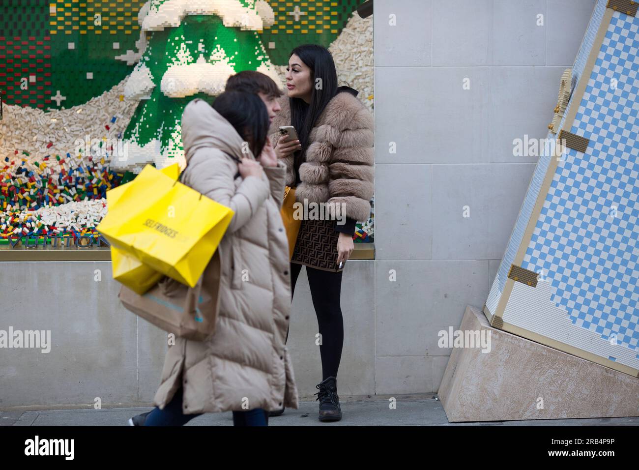 Shoppers walk in central London Stock Photo - Alamy
