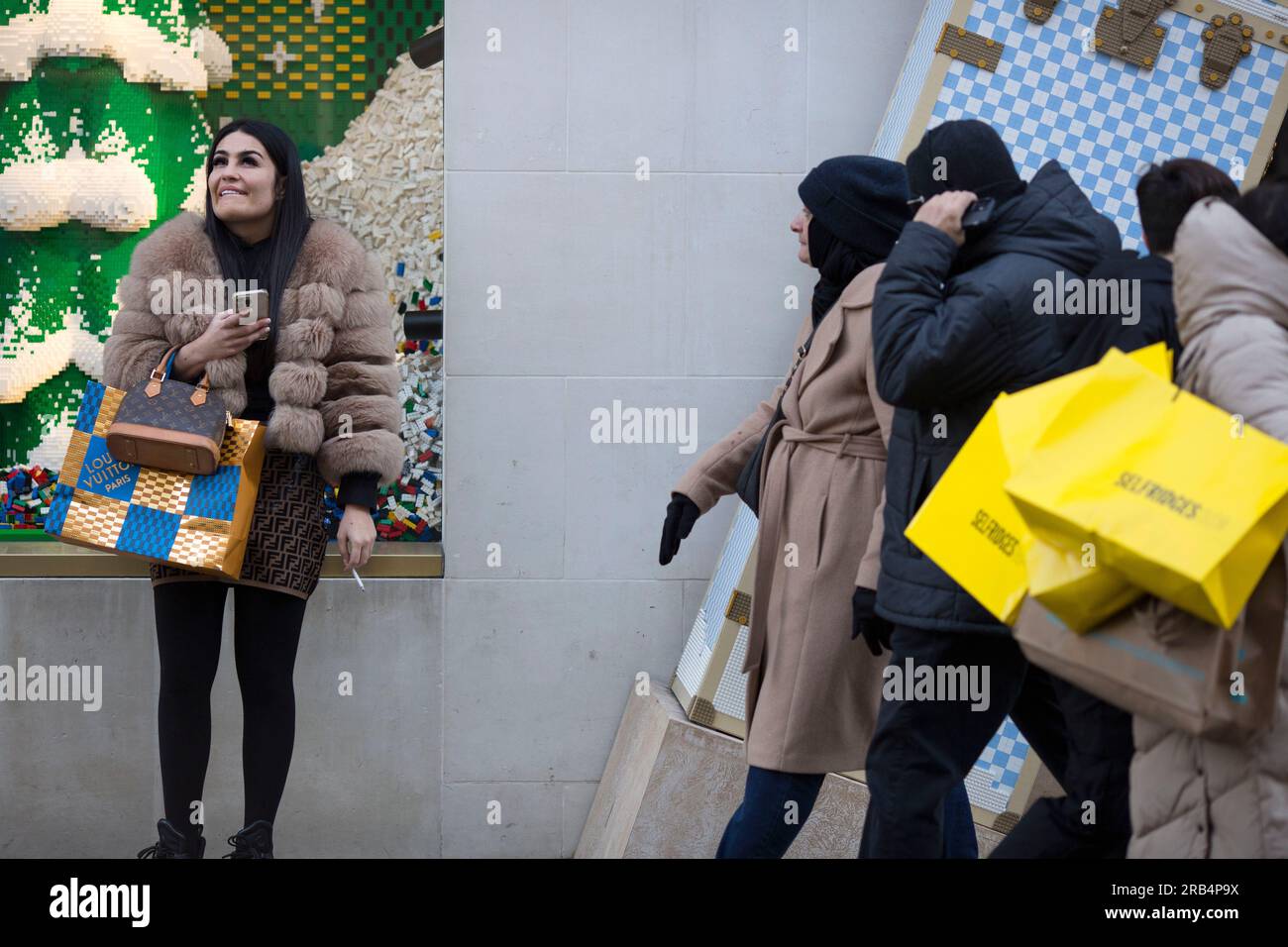 Shoppers walk in central London Stock Photo - Alamy