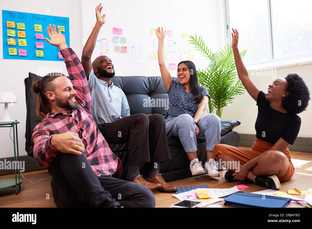 Team cheers lifting hands from hand stack, celebrate working together ...