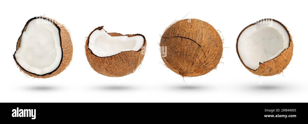 Flying coconut. Halves of coconuts on a white isolated background ...