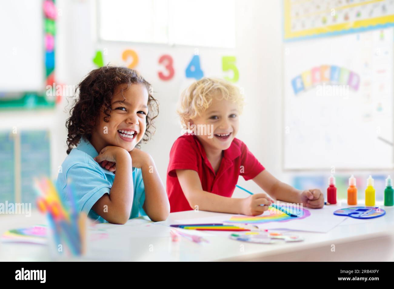 Kids go back to school. Interracial group of children of mixed age in ...