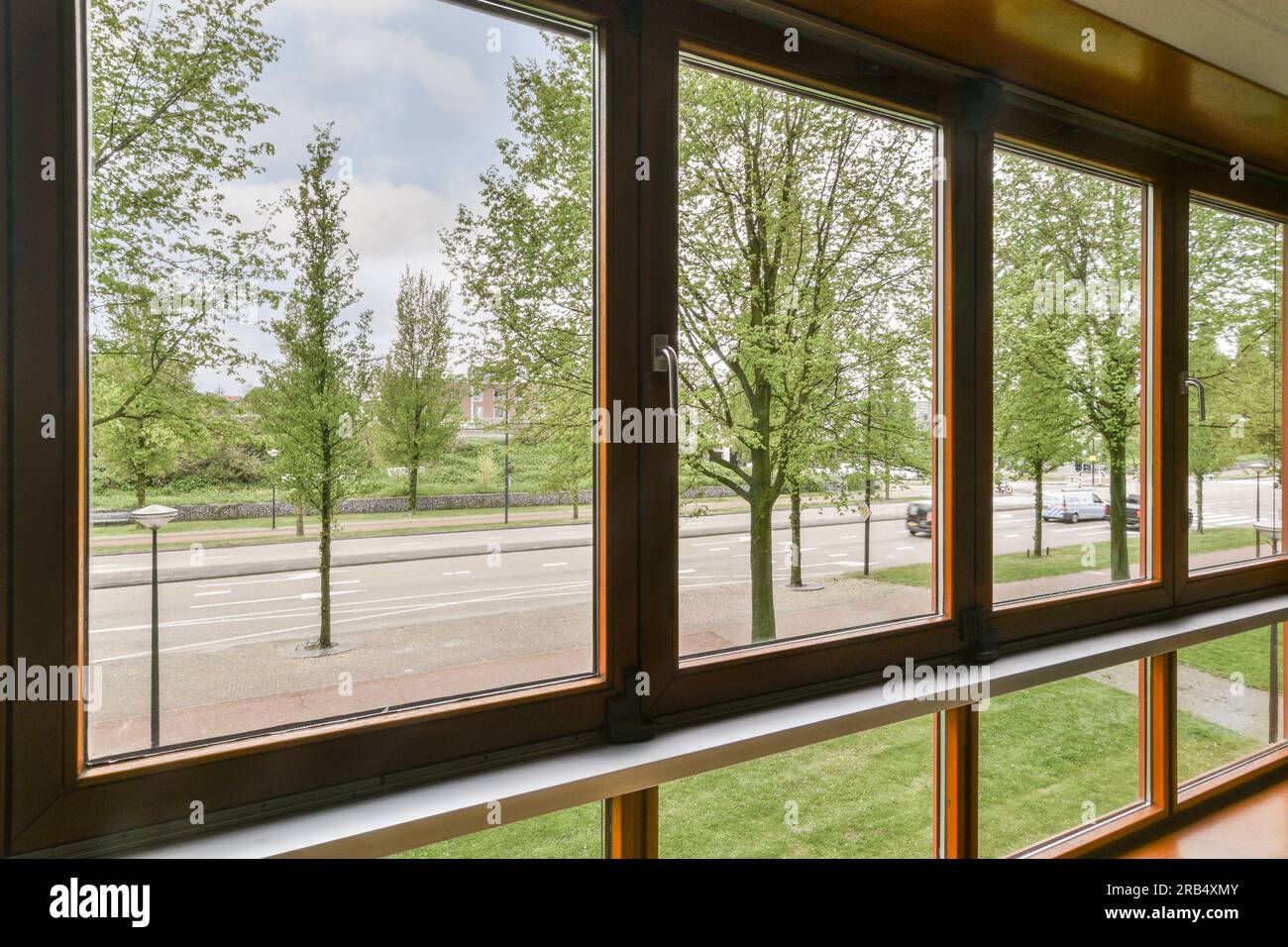 an outside view from inside a train car looking out onto the street ...
