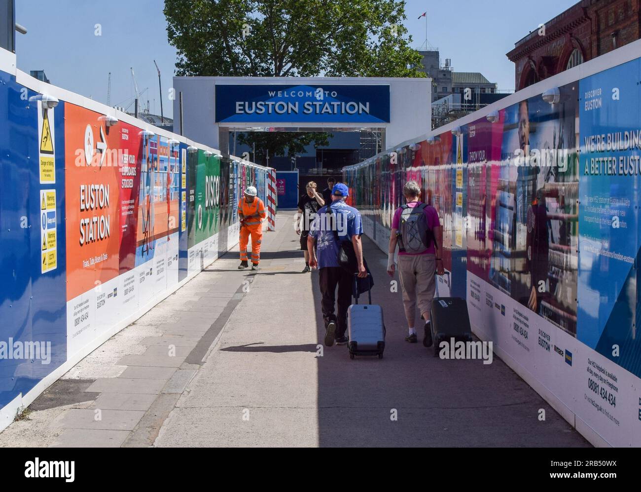 London, UK. 7th July 2023. Travellers pass by the HS2 (High Speed 2 ...