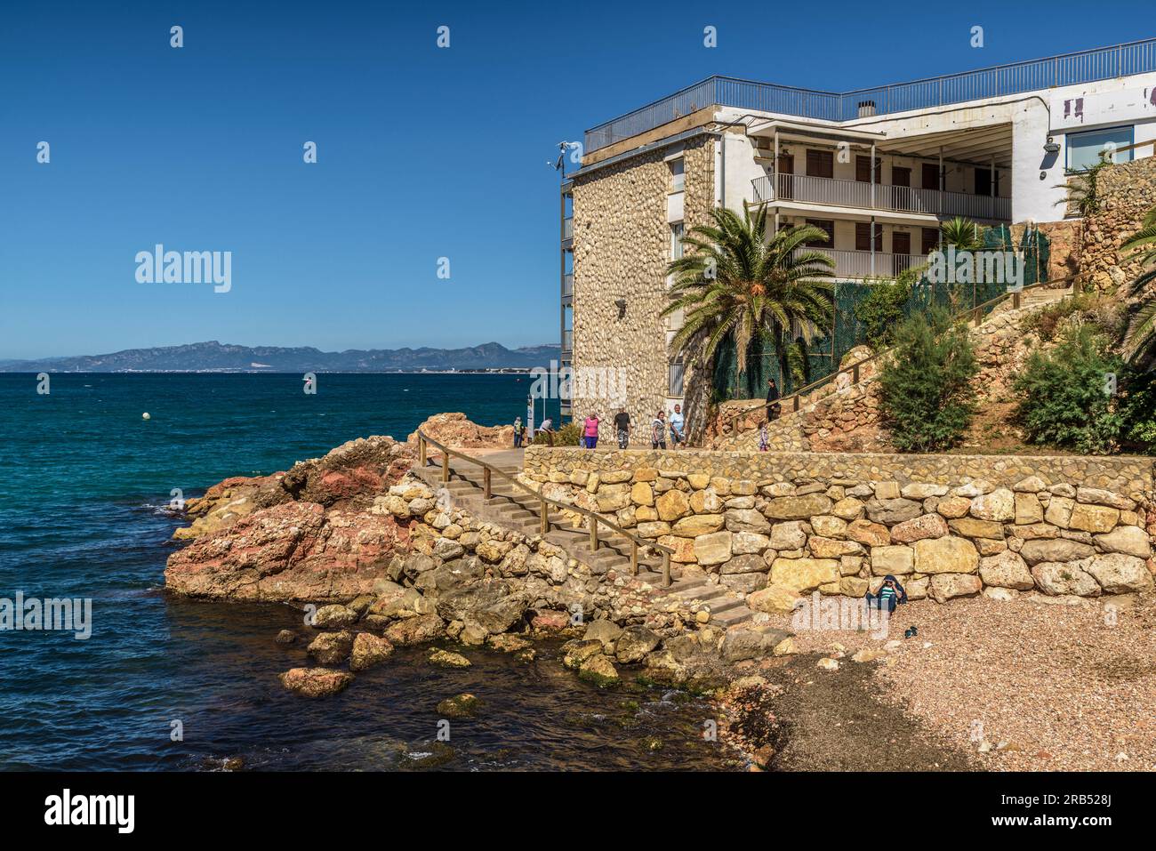 Winding coastal road that passes through the coves and beaches between ...