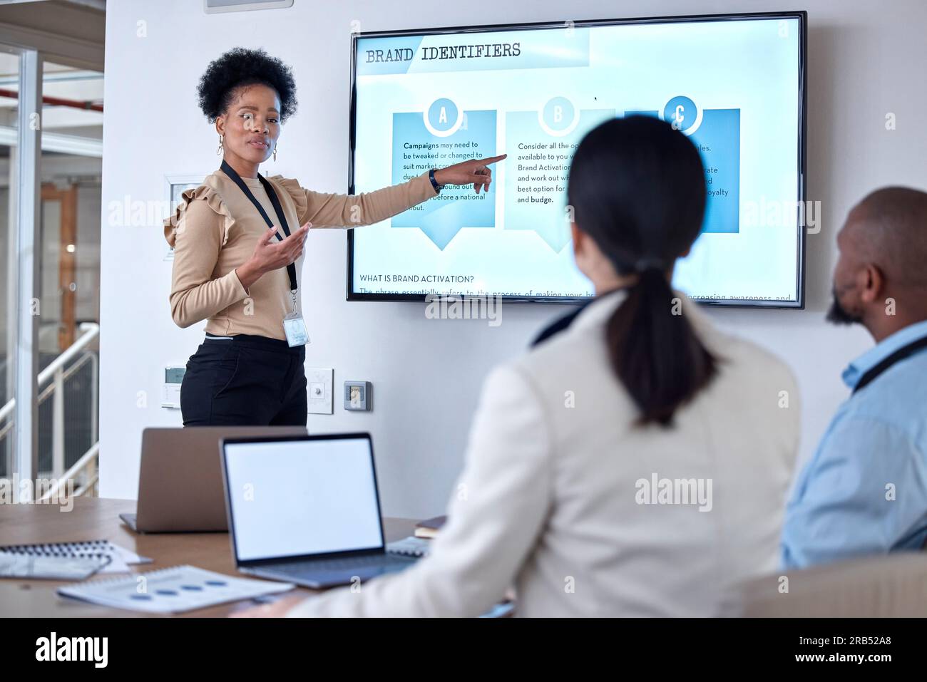Presentation, teamwork and businesswoman talking to colleagues in the ...