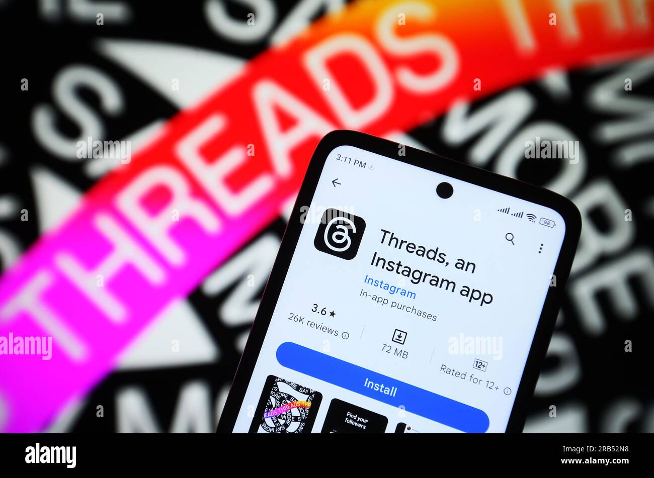 In this photo illustration, a Threads app logo seen displayed on a ...