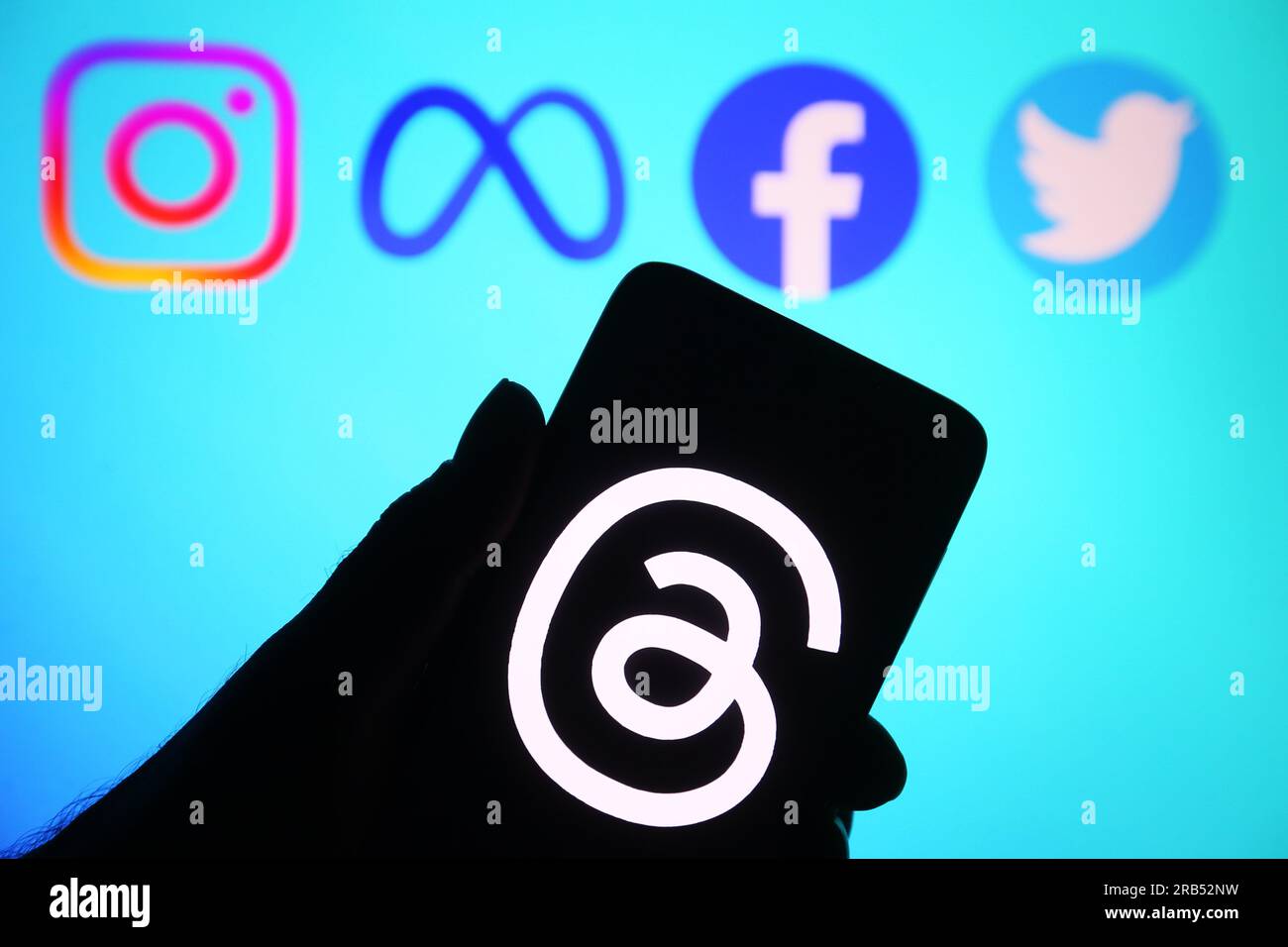 In this photo illustration, a Threads logo seen displayed on a ...