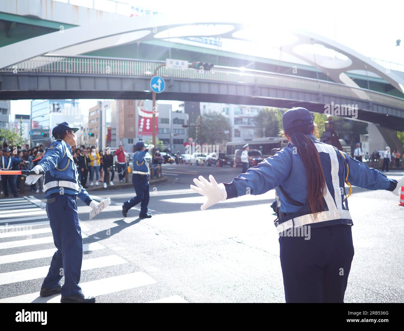 Japan Uniformed police officer organize traffic for road closures for ...