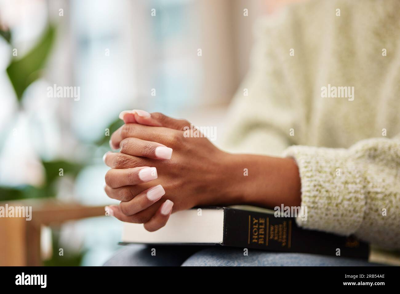 Hands, bible and woman praying for help, faith or gratitude to God ...