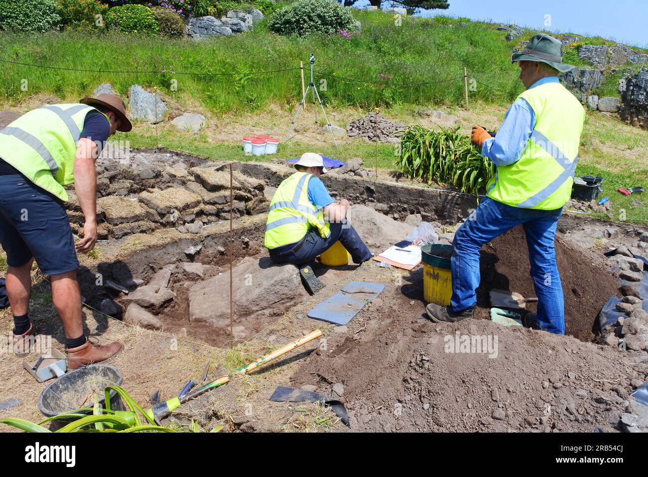 Archaeologists digging a trench with bronze age artefacts,St. Michaels ...