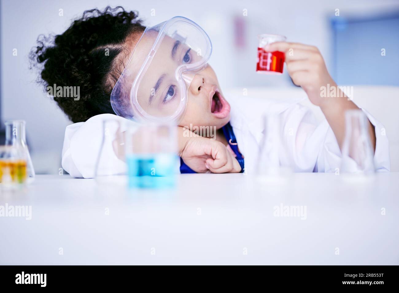 Child, science and chemistry with wow chemical in a laboratory for test ...