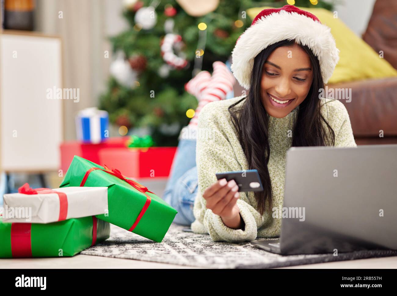 Christmas, e commerce and woman with laptop, credit card for online ...
