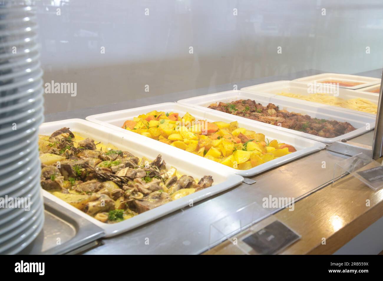 Various food served on a buffet line Stock Photo - Alamy