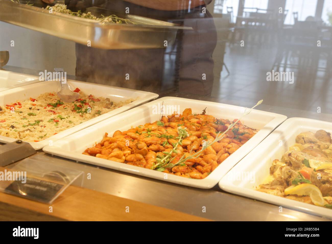 Various food served on a buffet line Stock Photo - Alamy