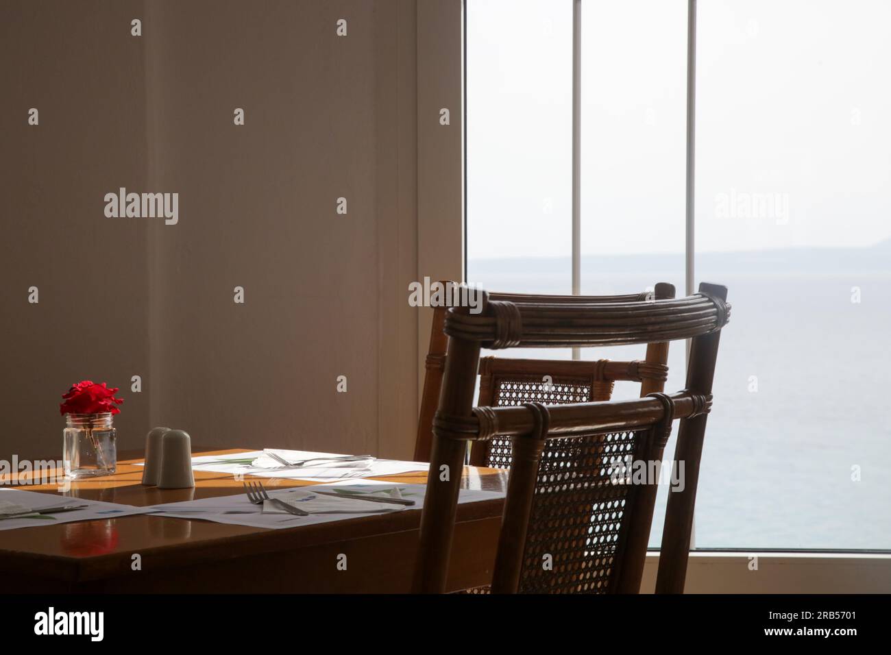 Empty seats and tables before dinner time in the indoor restaurant ...