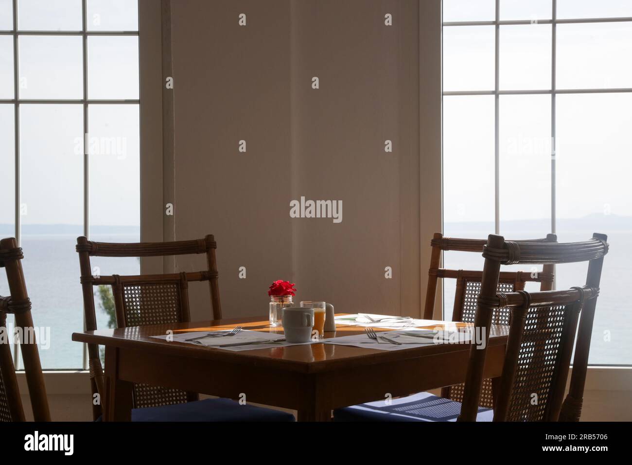 Empty seats and tables before dinner time in the indoor restaurant ...