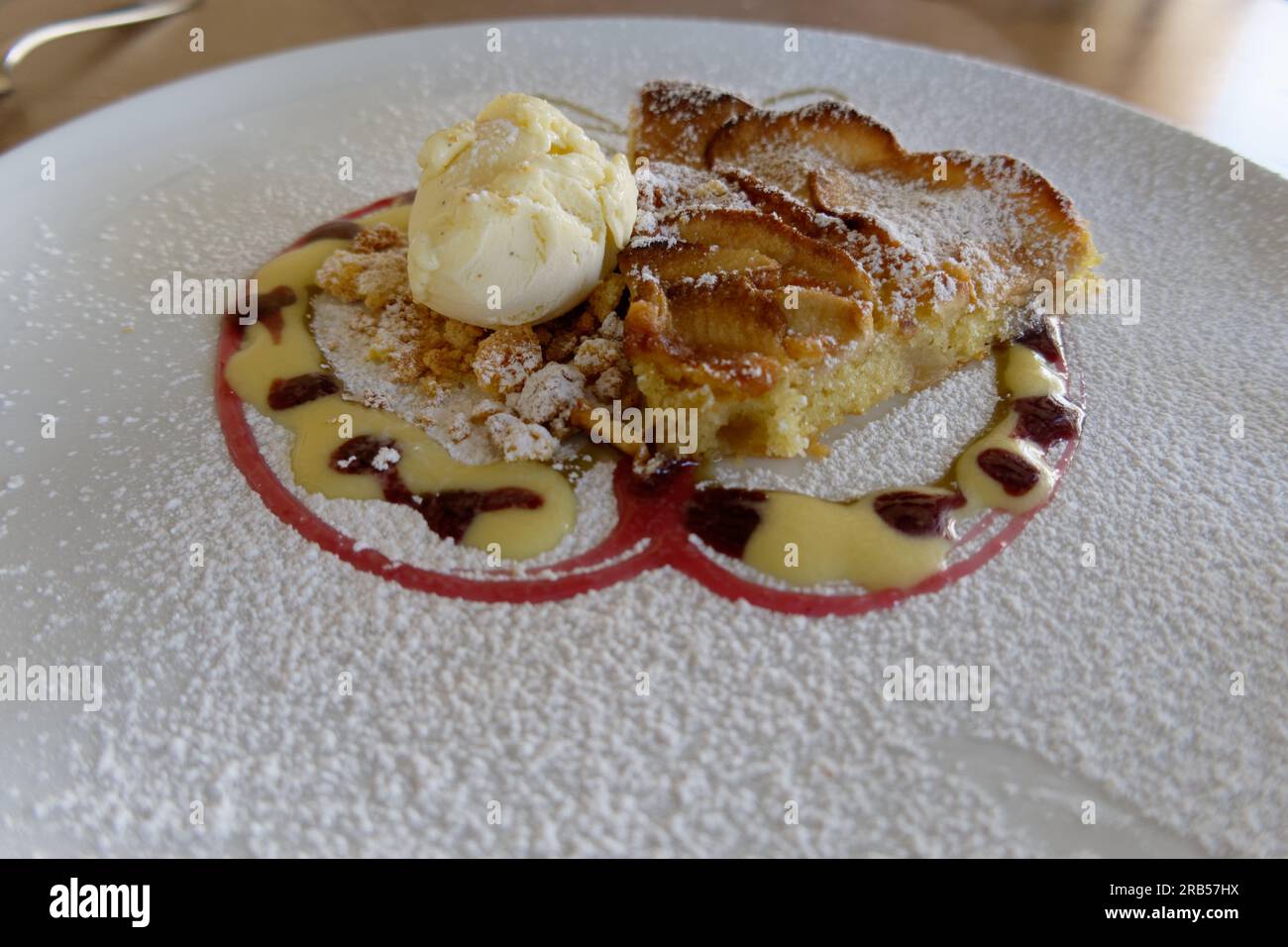 Apple pie with vanilla ice cream . The italian dessert is garnished ...