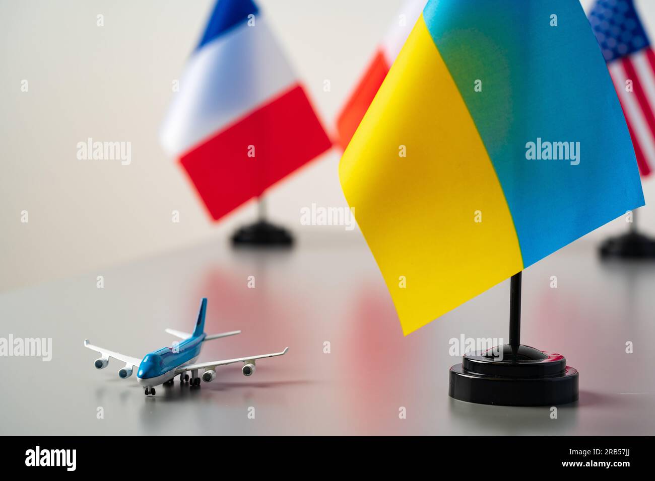 Flags and toy airplane close up. Travel concept Stock Photo - Alamy