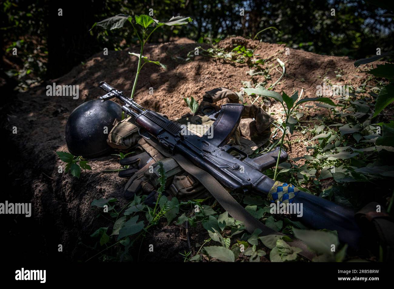 Rifle and helmet seen at an undisclosed position in Novodarivka ...