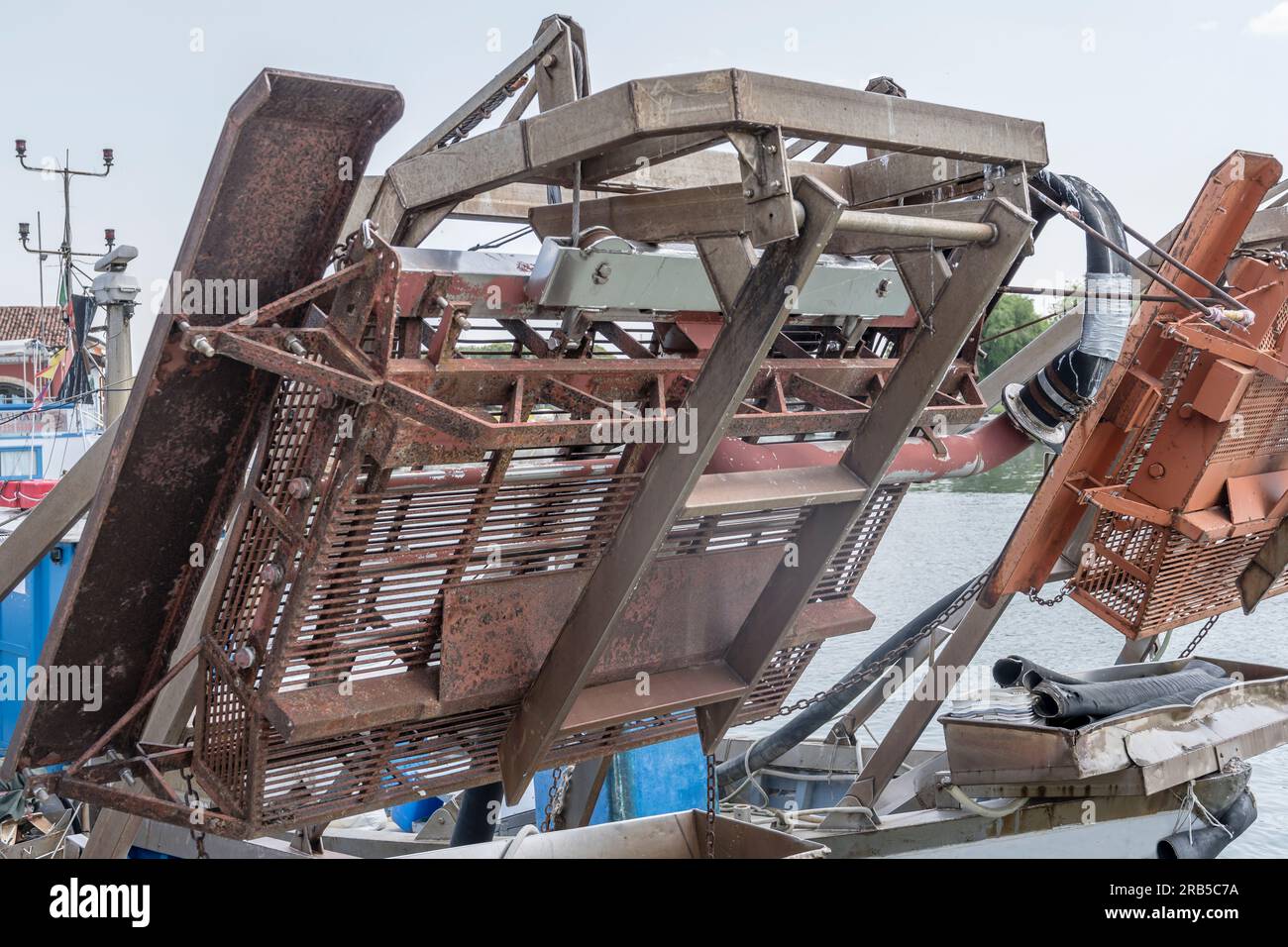 detail of clam-rake on Vongolara fishing boat moored at harbor in ...