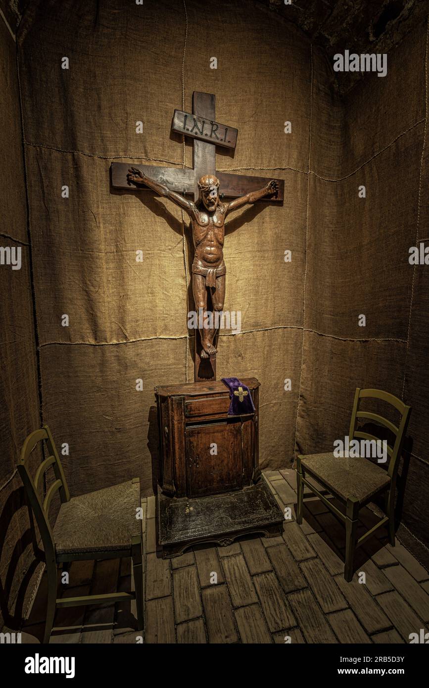 Medieval wooden crucifix in the confessional chapel of the church of ...