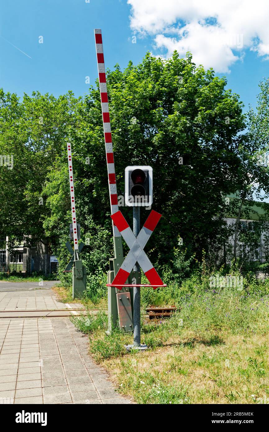 Level crossing with barriers, traffic lights and St. Andrew's cross ...