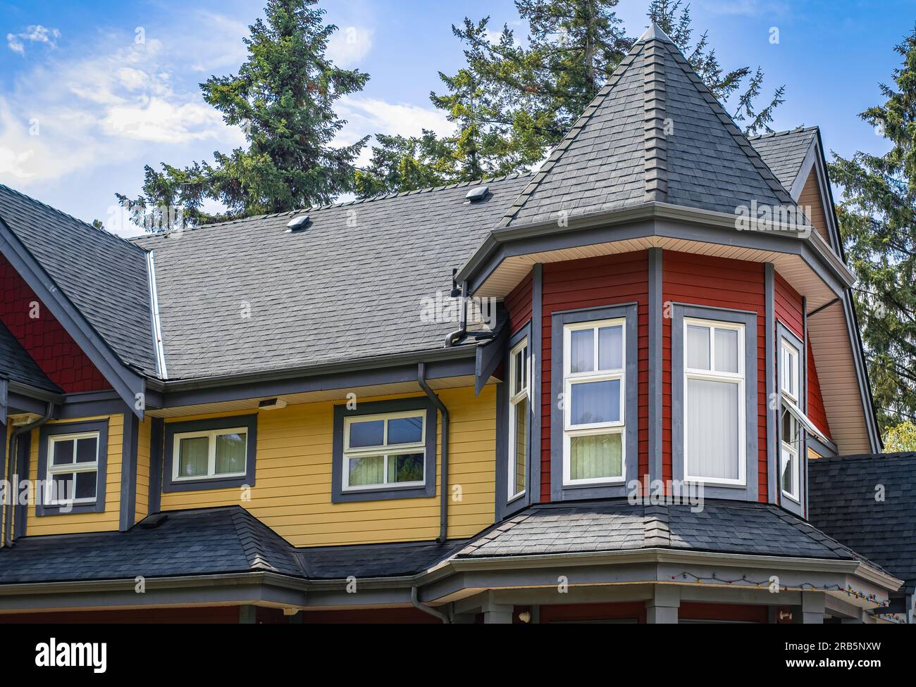Facade of new residential townhouses. Top of a modern buildings with ...
