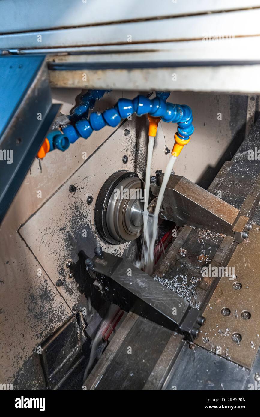 Milling metalworking process. Industrial CNC metalworking with vertical ...